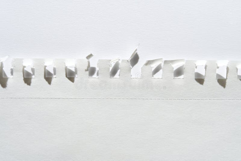 Close-up of Torn White Paper with Perforated Edge and Folded Tabs ...
