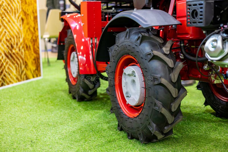 Close-up of Tractor Wheels. Modern Walk-behind Tractor. Red Tractor ...