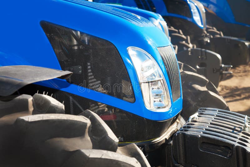 Close Up of Tractors on a Row Stock Photo - Image of powerful, rural ...