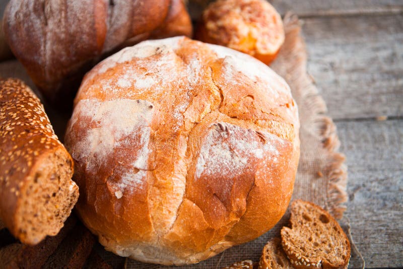 Close-up of Traditional Fresh Bread on Rustic Table Stock Photo - Image ...