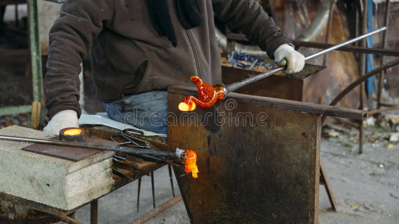 Close Up of Traditional Glass Blower Forming a Beautiful Piece of Glass ...