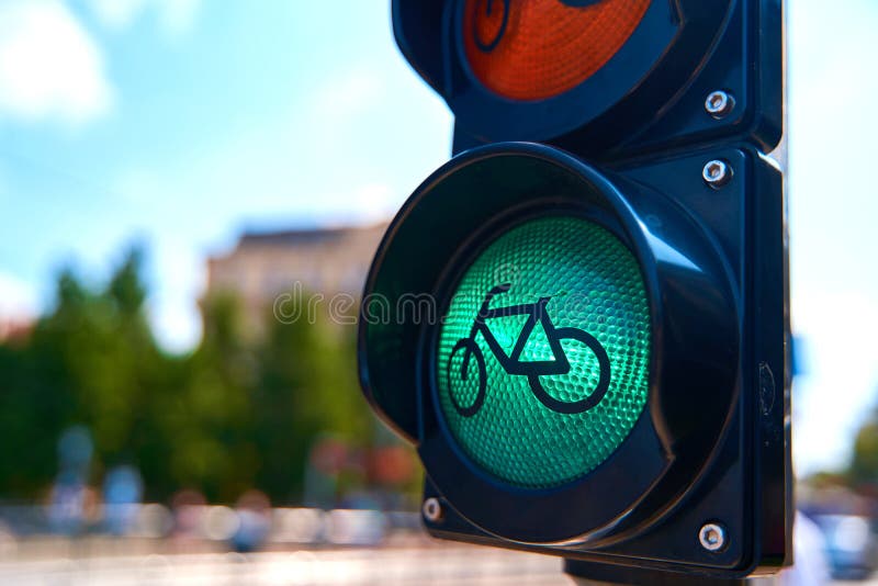 Close-up of a Traffic Light for Cyclists, Which is Glowing Green. a ...