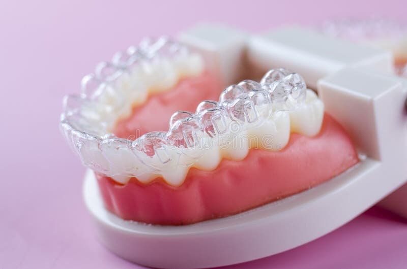 Invisible and Removable Aligners for Teeth Alignment on a Pink ...