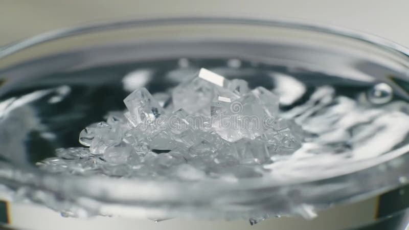 Close-up of Transparent Crystals Dissolving in Water, Showing the ...