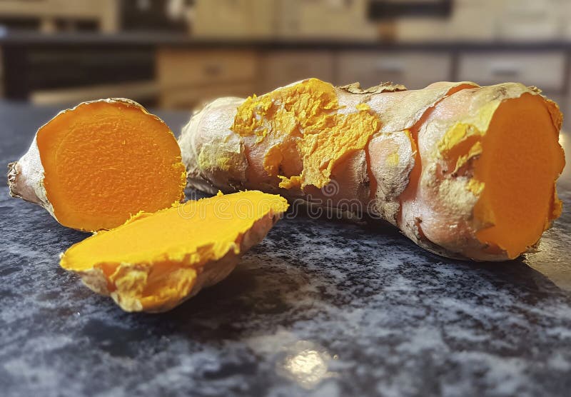 Close-up of Turmeric Root Sliced on Countertop Stock Illustration ... Close-up of Turmeric Root Sliced on Countertop Stock Illustration ...