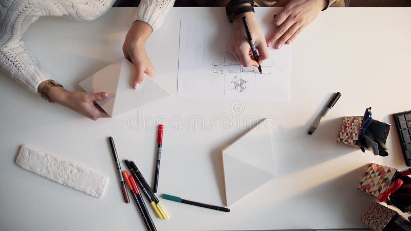 Close Up of Two Architects Discussing Plan Together at Desk Timalaps ...