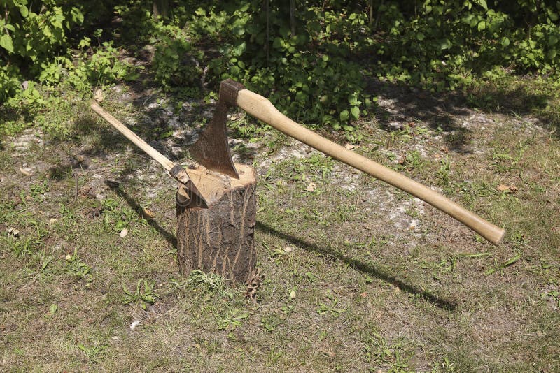 A Close-up of Two Axes in a Chopping Block Stock Image - Image of ...