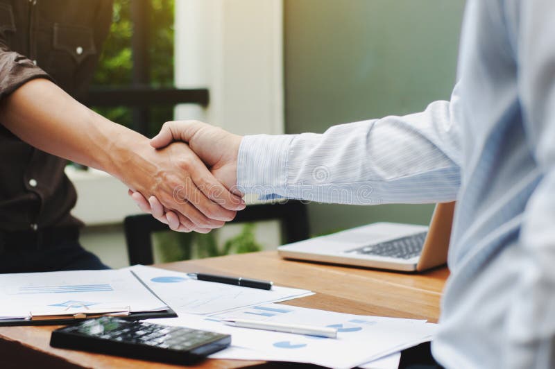Two Business Executives Standing at Meeting Table with Document Stock ...