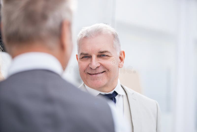 Close Up. Two Business Men Talking in the Office Stock Photo - Image of ...