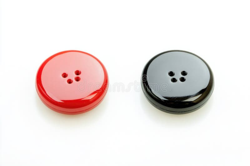Close-up of Two Buttons on a Clean Background, One Red and One Black ...