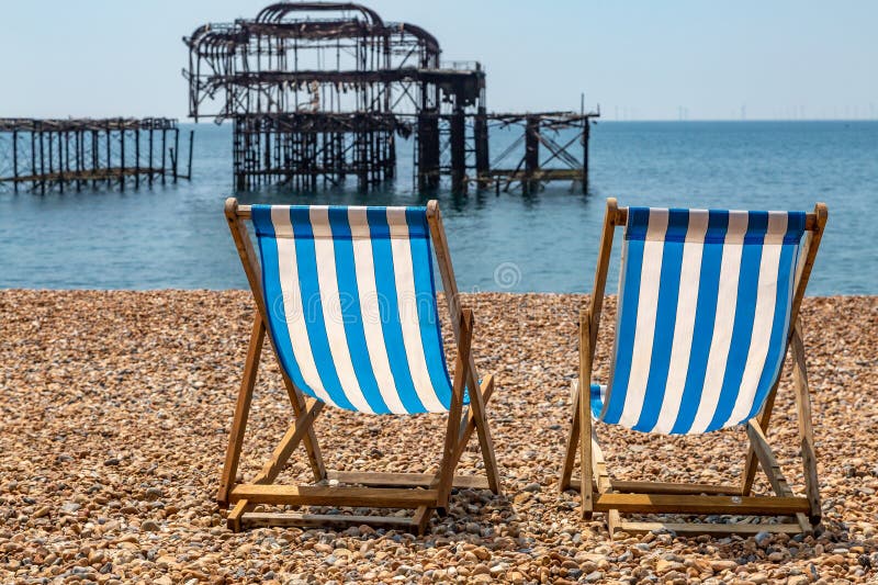 Deck Chairs on Brighton Beach, with a View of the West Pier Behind and ...