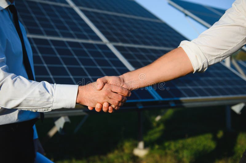Close Up of Two Electrical Engineers Shaking Hands after Working To ...