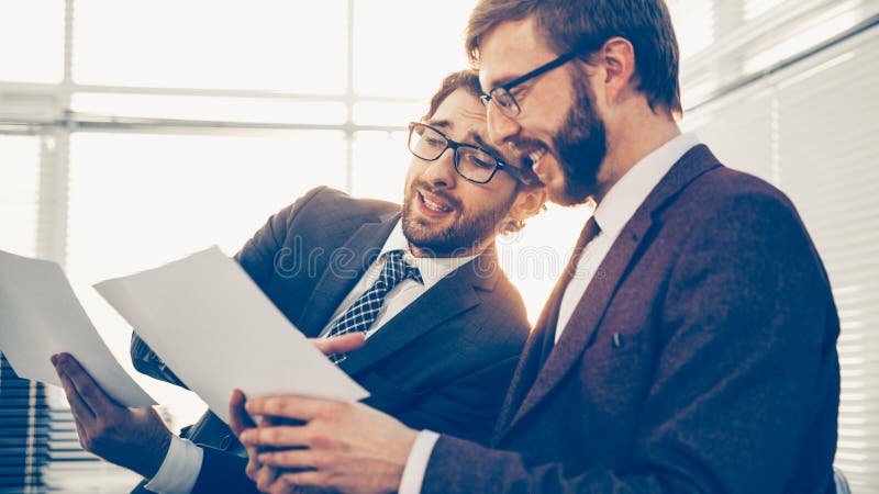 Close Up. Two Employees Discussing Business Documents Stock Image ...