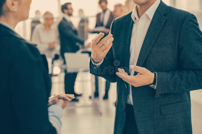 Close Up. Two Employees Discussing Work Issues Stock Photo - Image of ...