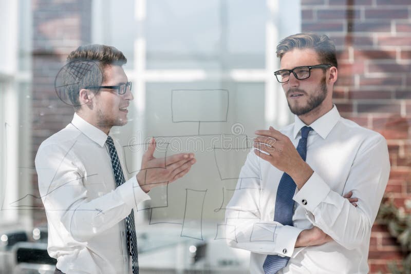 Close Up.two Employees Talking Standing in the Office Stock Photo ...