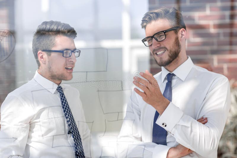 Close Up.two Employees Talking Standing in the Office Stock Photo ...