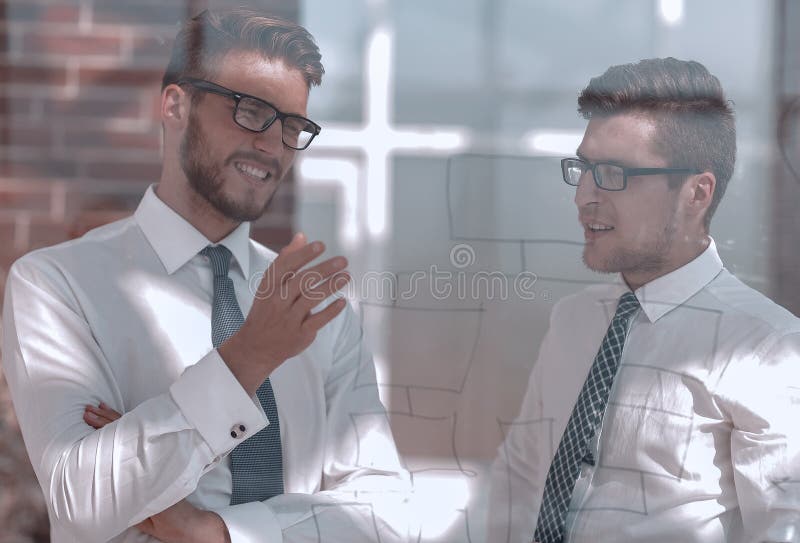 Close Up.two Employees Talking Standing in the Office Stock Image ...