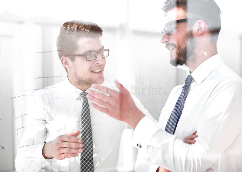 Close Up.two Employees Talking Standing in the Office Stock Photo ...