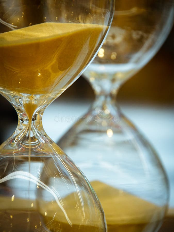 A Close-up of Two Hourglasses Stock Photo - Image of indoors, close ...