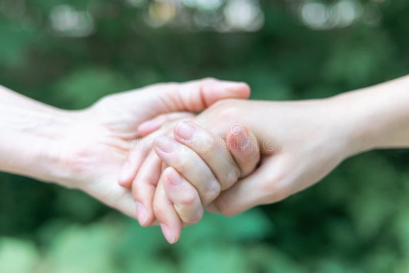 Close-up of Two Interlocking Female Hands Stock Image - Image of ...