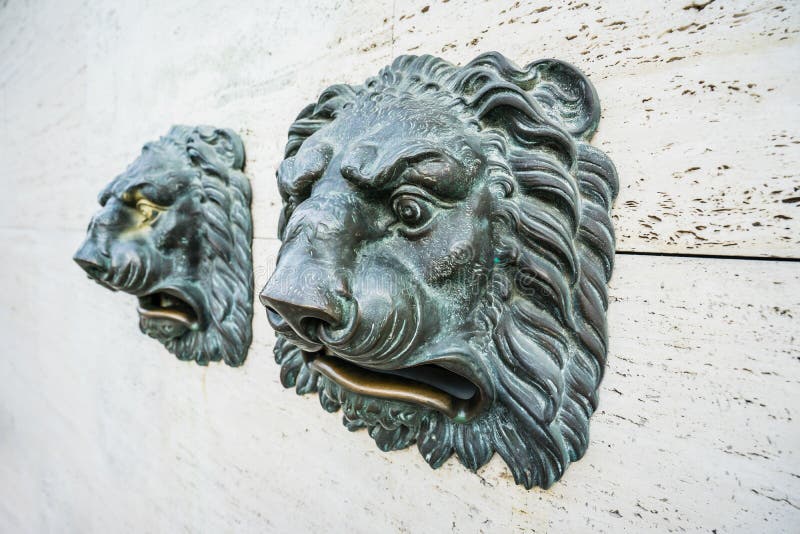 Close-up of Two Lion Heads on Wall Stock Image - Image of lion ...