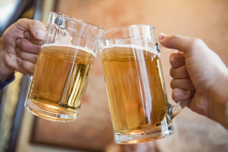 Two men toasting with beer stock image. Image of clinking - 177816117