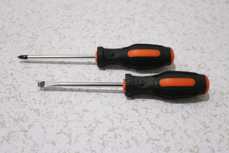 Close-up of a Two Orange Screwdriver Stock Image - Image of orange ...