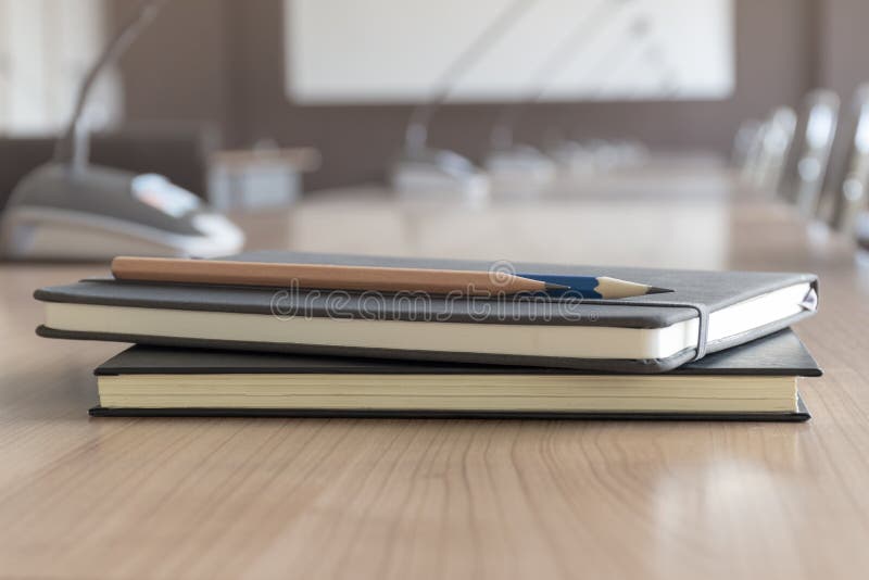 Close Up Two Pencil and Notebook on Table in Meeting Room Stock Photo ...