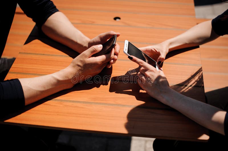 Close-up of Two People Hands with Mobile Phones Stock Image - Image of ...