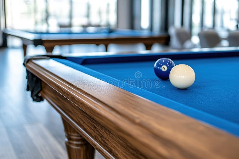 Close-up of Two Pool Balls on a Blue Billiards Table in a Modern ...