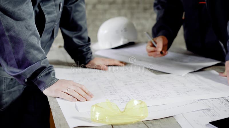 Close Up of Two Professional Engineers Making Construction Project ...