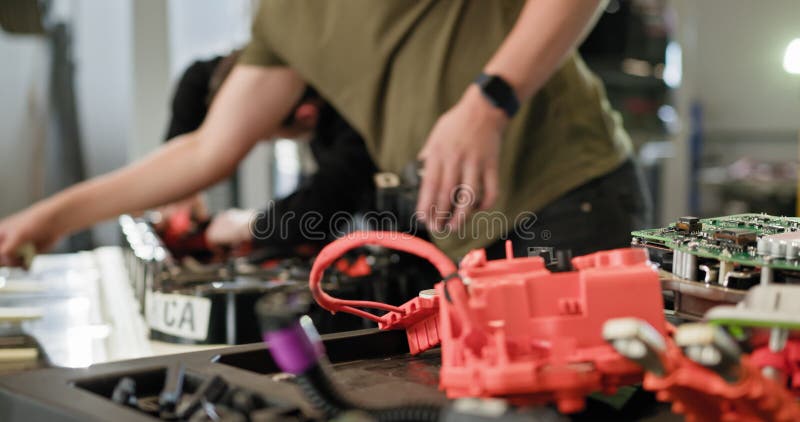Technicians Assembling Electric Car Batteries in Workshop Stock Video ...