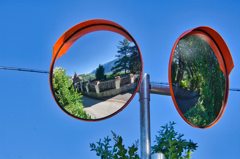 Close-up of a Two-way Street Mirror, Reflecting a Building and Its ...
