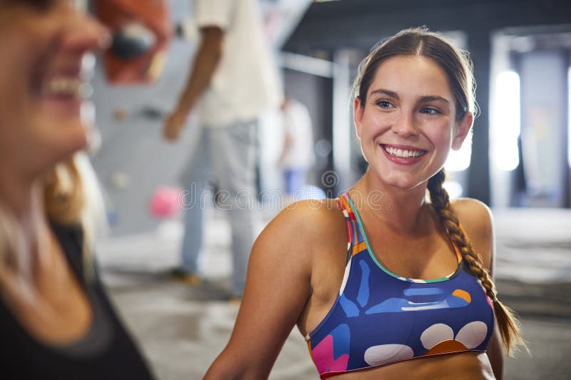 Close Up of Two Women Taking a Break and Talking by Climbing Wall in ...