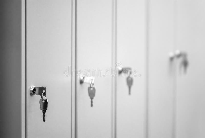 Close-up of Typical Grey Metal School Lockers with Keys in the Doors ...
