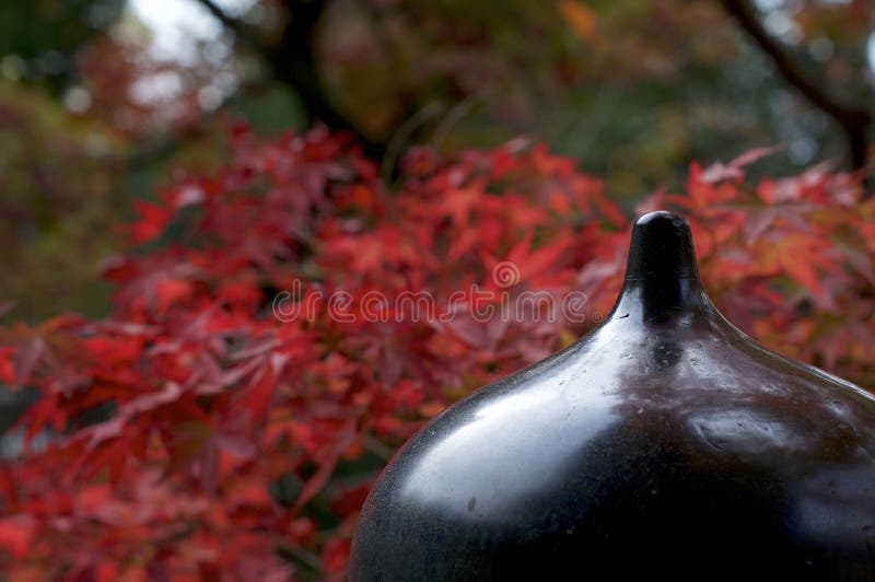 Close Up of a Typical Japanese Bridge Post with Red Colored Maple Leave ...