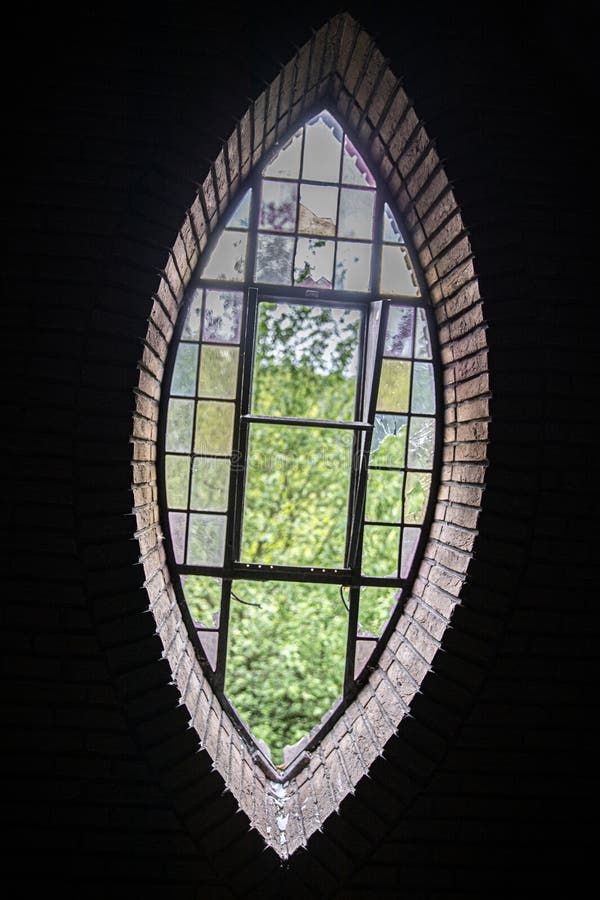 Broken Stained Glass Window with Gothic Arch in Abandoned Building ...