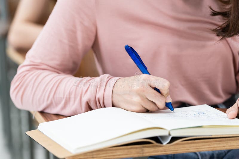 Close-up of the University Students Writing Note on Notebook in the ...