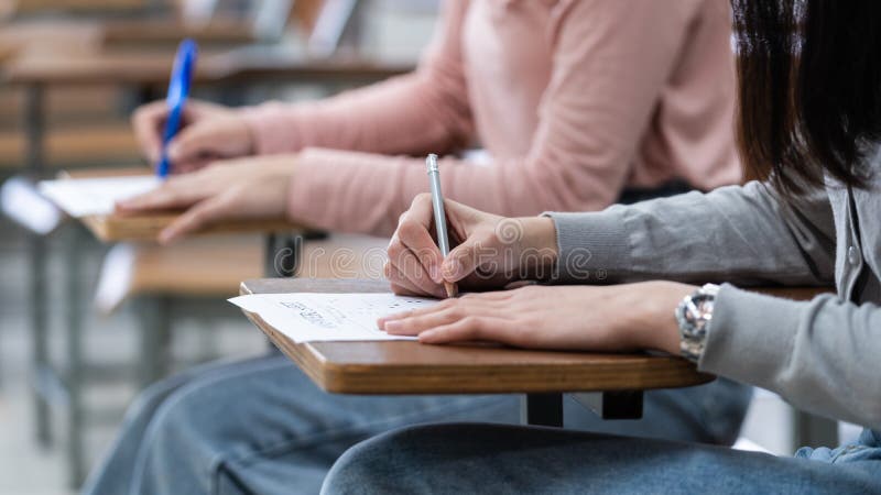 Close-up of the University Students Writing Note on Notebook in the ...