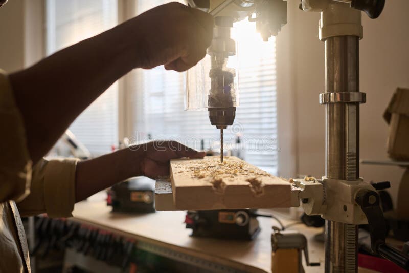 Close Up of Carpenter Drilling Wood Using Machine Tool in Workshop with ...