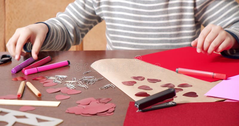 Close-up of an Unrecognizable Child Making a Handmade Postcard from Red ...