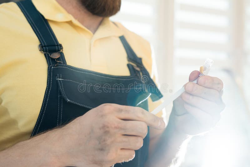 Examining networking cable stock image. Image of electrician - 134679517