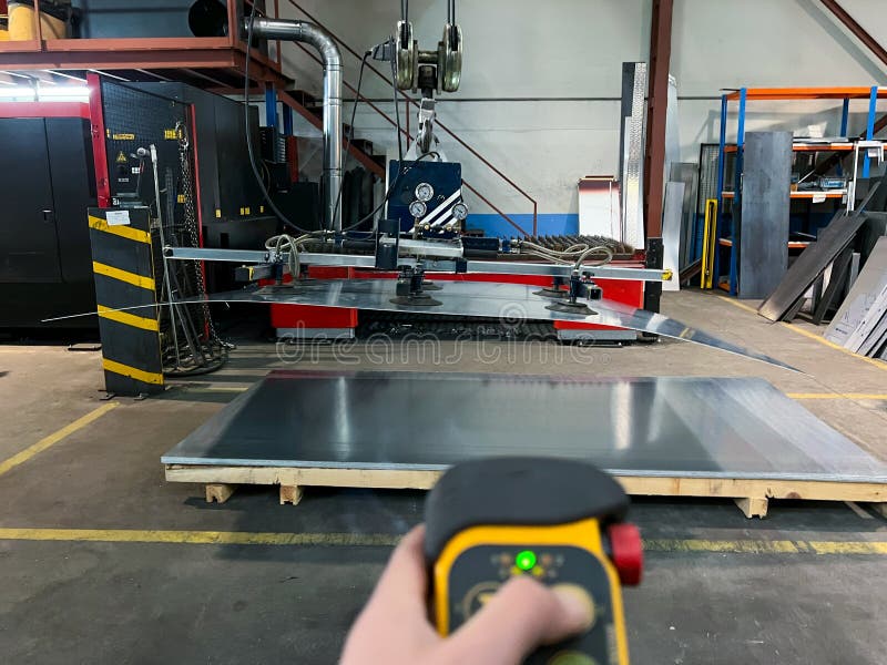 Close-up of an Unrecognizable Worker Using a Remote Control To Use the ...