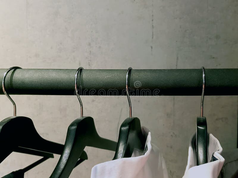 Upper Section of Cloth Hangers Inside the Wardrobe Stock Photo - Image ...