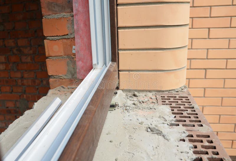 A Close-up on Upvc Window Installation White Inside and Brown Outside ...