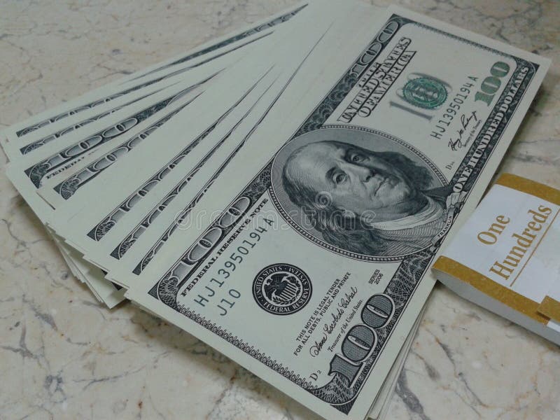 US Dollars Currency Notes in One Hundred Denomination on the Table ...