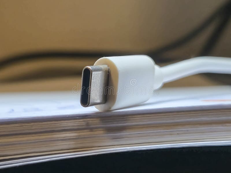 Close-up of a USB-C Connector on a White Cable, Showcasing Modern ...
