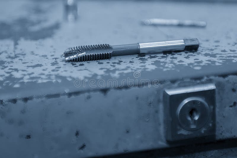 Close Up of the Used Machine Tapping Tool in Light Blue Scene Stock ...
