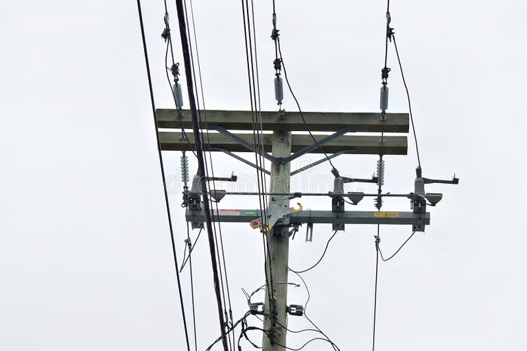 Close-up of a Utility Pole with Multiple Power Lines and Insulators ...