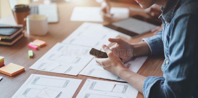Close-up of UX Web Development Plaining the Idea on Smartphone ...